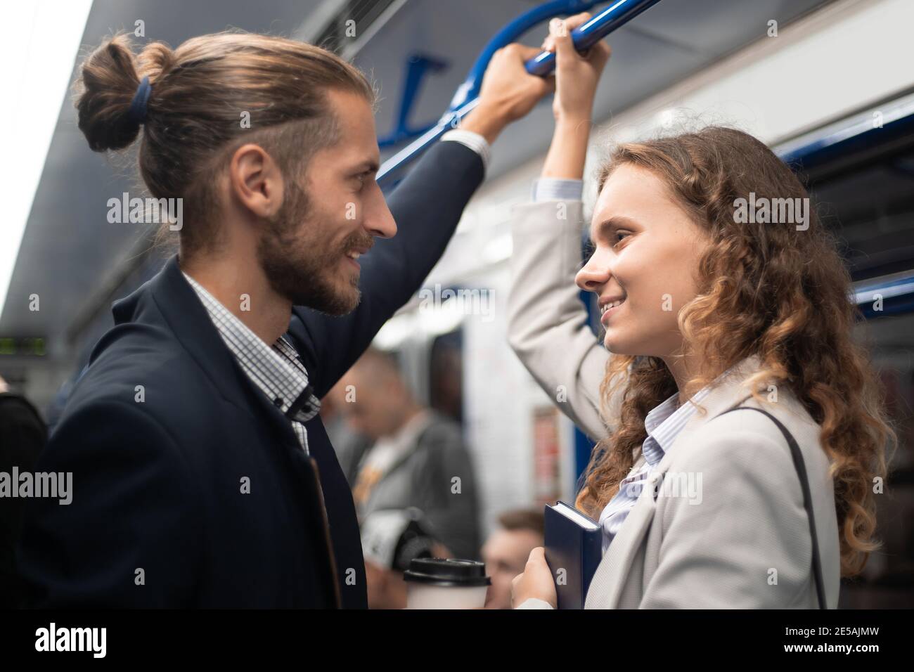 beautiful young people looking at each other in the subway train Stock ...