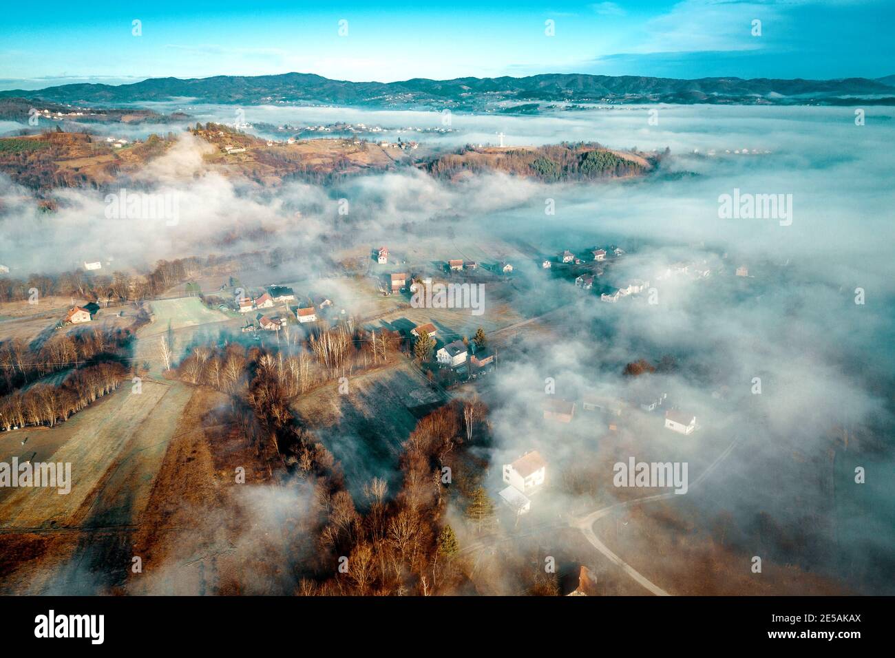 Aerial view of beautiful foggy landscape in Bosnian countryside at ...