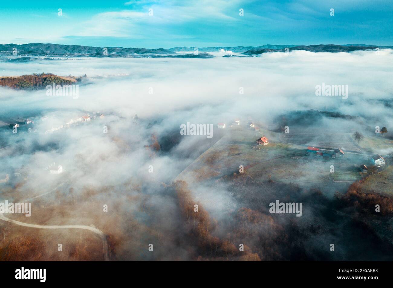 Aerial view of beautiful foggy landscape in Bosnian countryside at ...