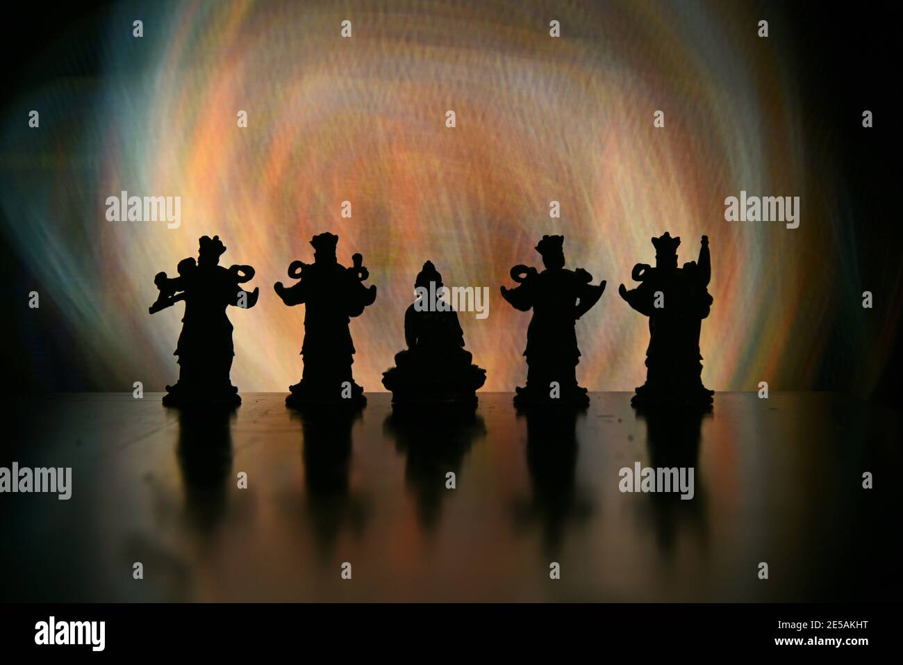 Copper Buddha statue placed at the center among four guardian deities ...