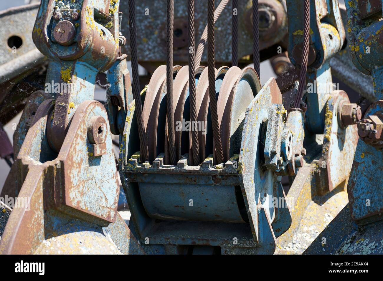 Closeup of rustic pulleys with cables in a machine shop Stock Photo - Alamy