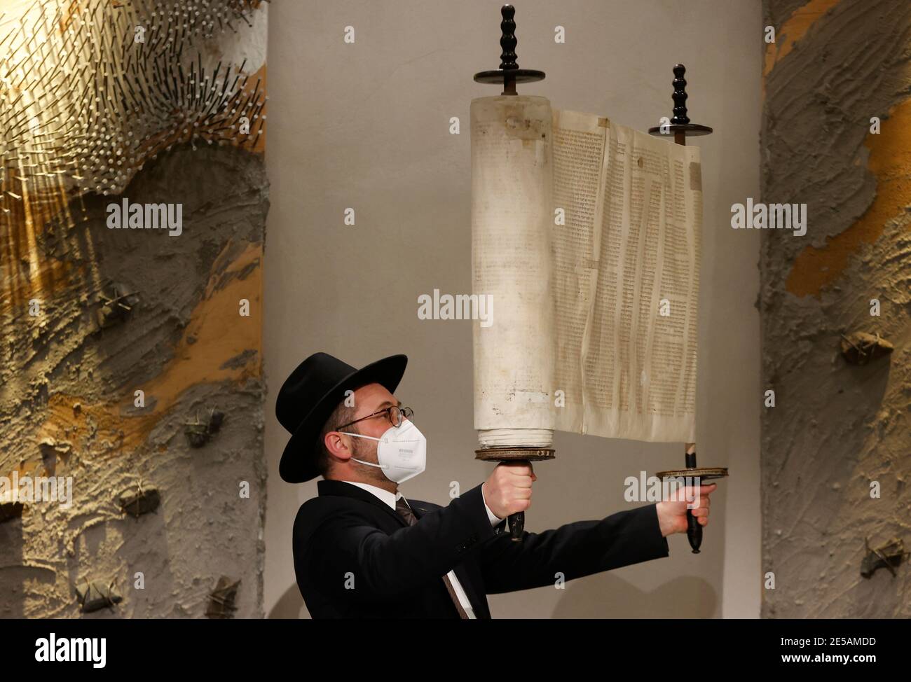 Berlin, Germany. 27th Jan, 2021. Rabbi Shaul Nekrich holds up the ...