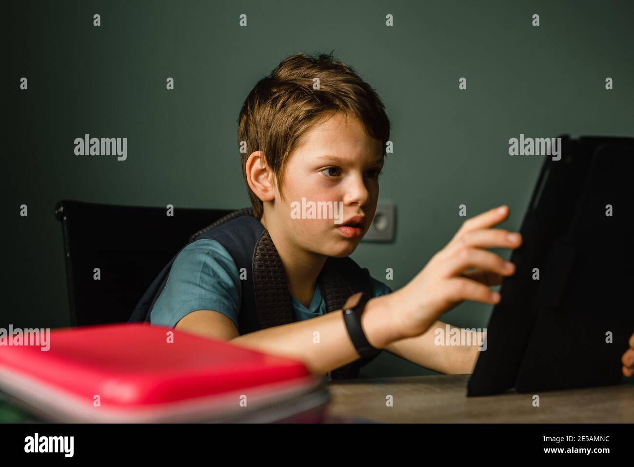 School boy playing tablet at home, growing up with technology Stock ...