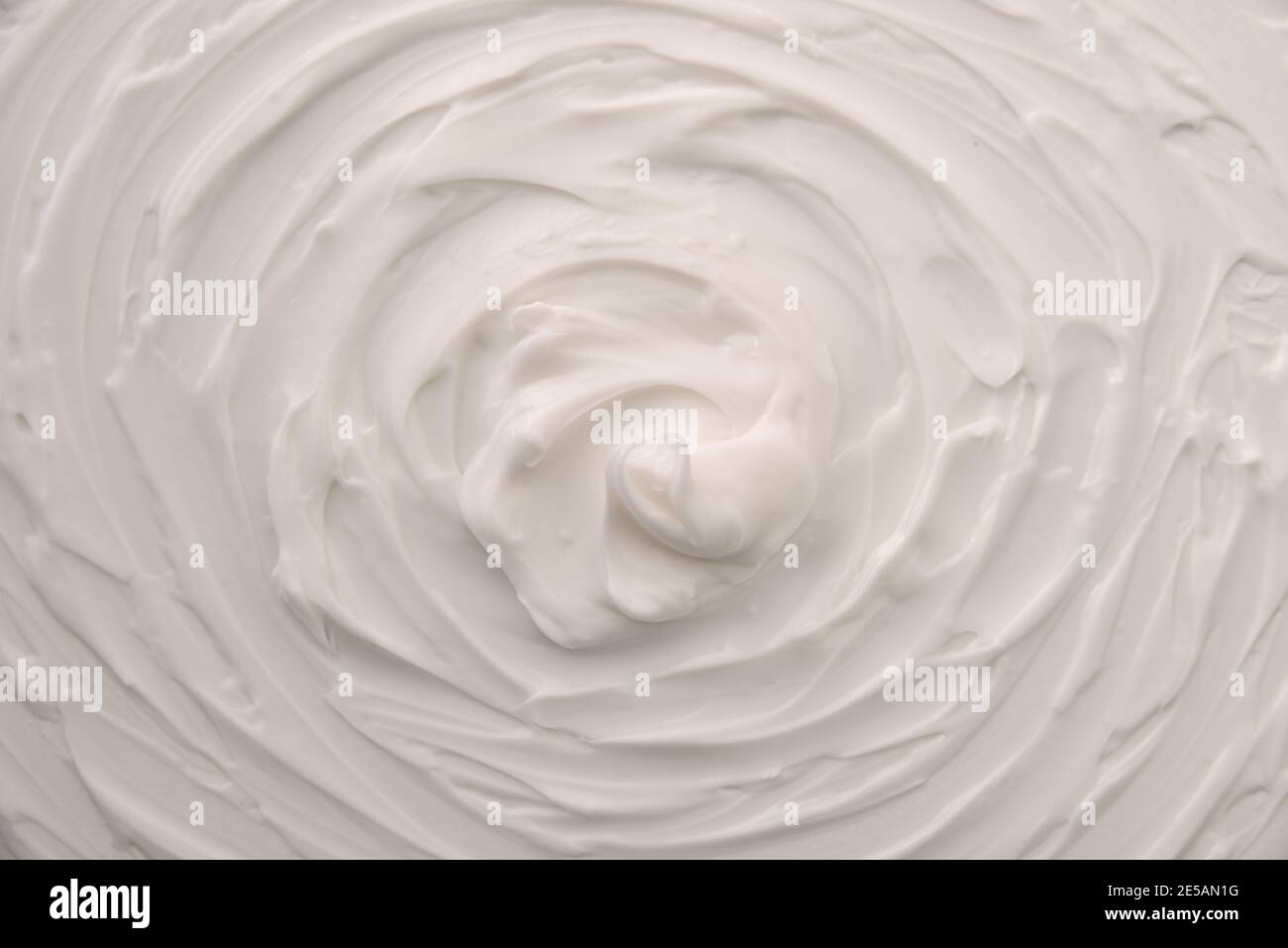 White cosmetic spiral skin cream texture background. Horizontal ...
