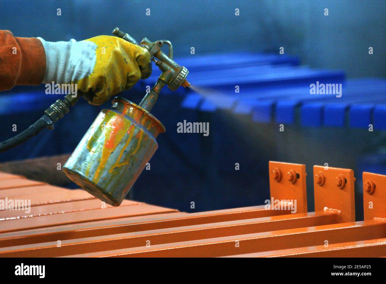 Worker applying paint metal hi-res stock photography and images - Alamy