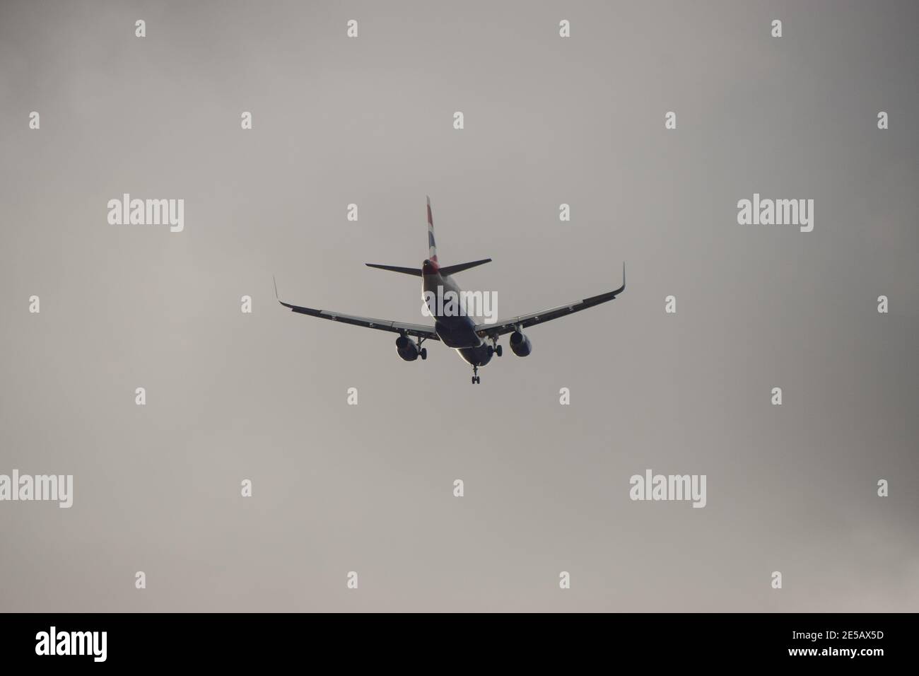 An airplane flying over Heathrow Airport, London Stock Photo - Alamy