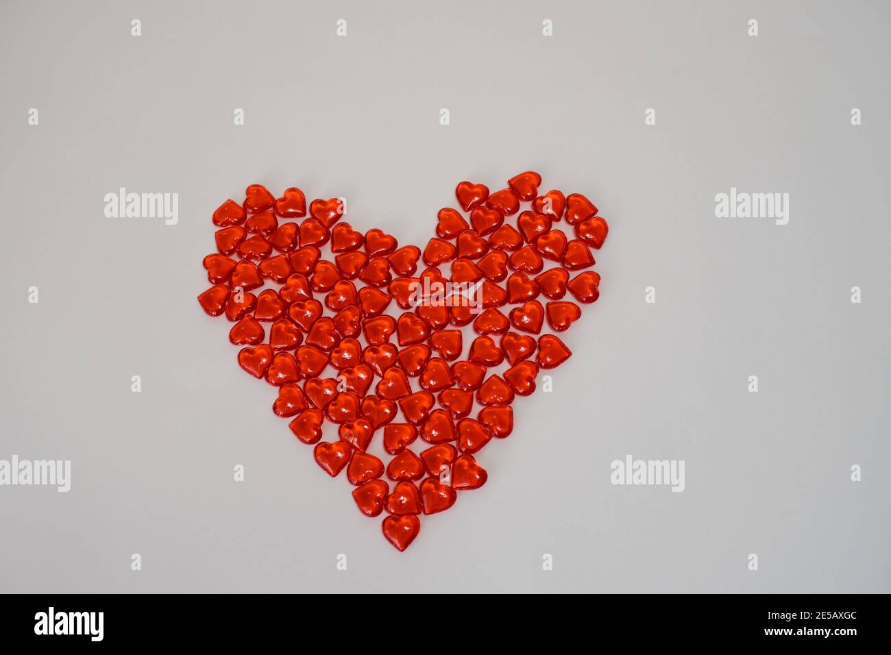 Heart shape of small red hearts on a white background. The view from ...