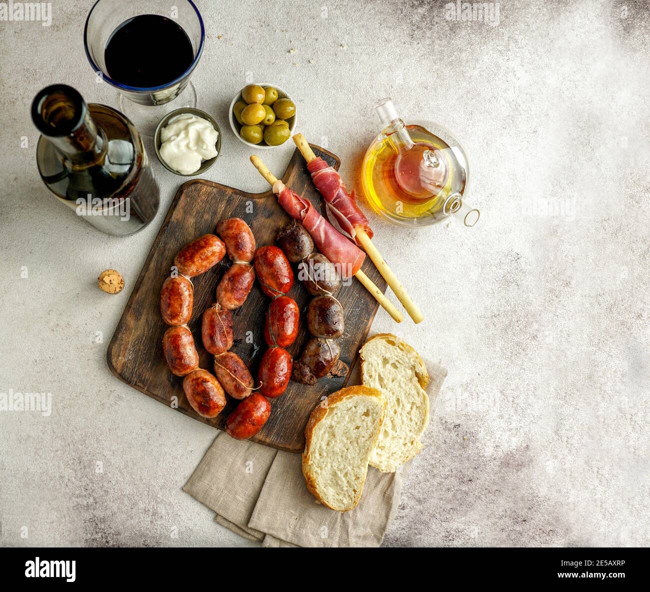 roasted spanish sausages on the cutting board - butifarra blanca ...