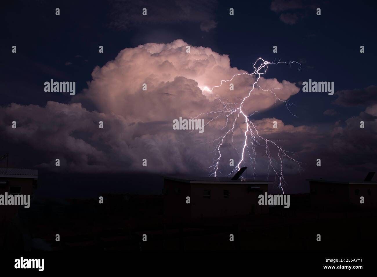 A Massive lighting bolt shooting out a thundercloud Stock Photo - Alamy