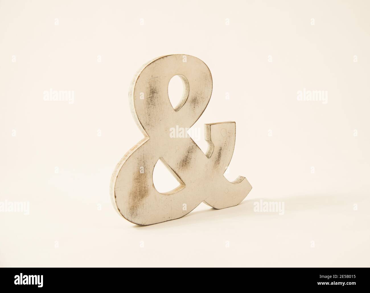 Wooden Ampersand sign on a white background Stock Photo - Alamy