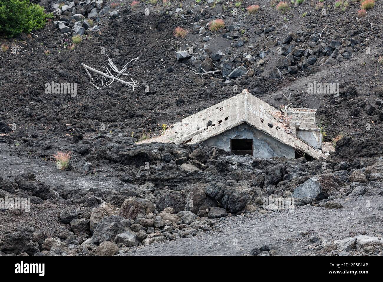 House buried under lava on southern flank of Mount Etna volcano, Sicily ...