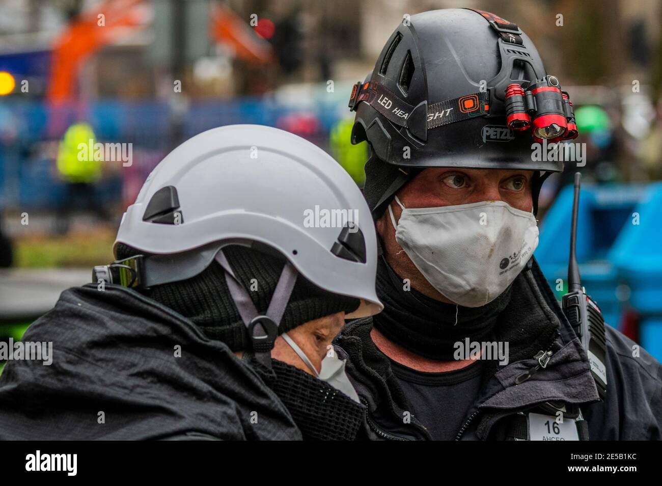 London, UK. 27th Jan, 2021. Bailiffs in helmet swith head torches ...