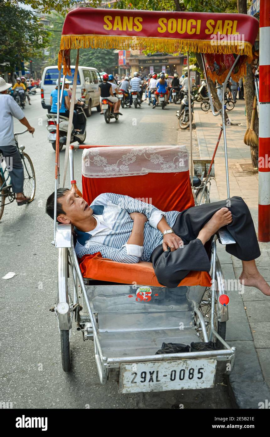 Man taking a nap on his tuktuk, Hanoi, Vietnam Stock Photo - Alamy