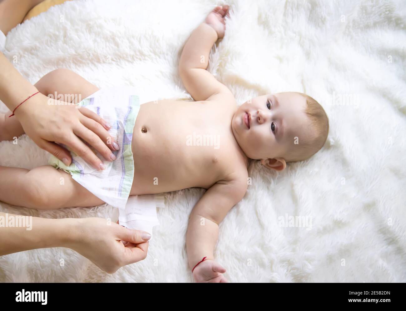 Changing babys diaper hi-res stock photography and images - Alamy