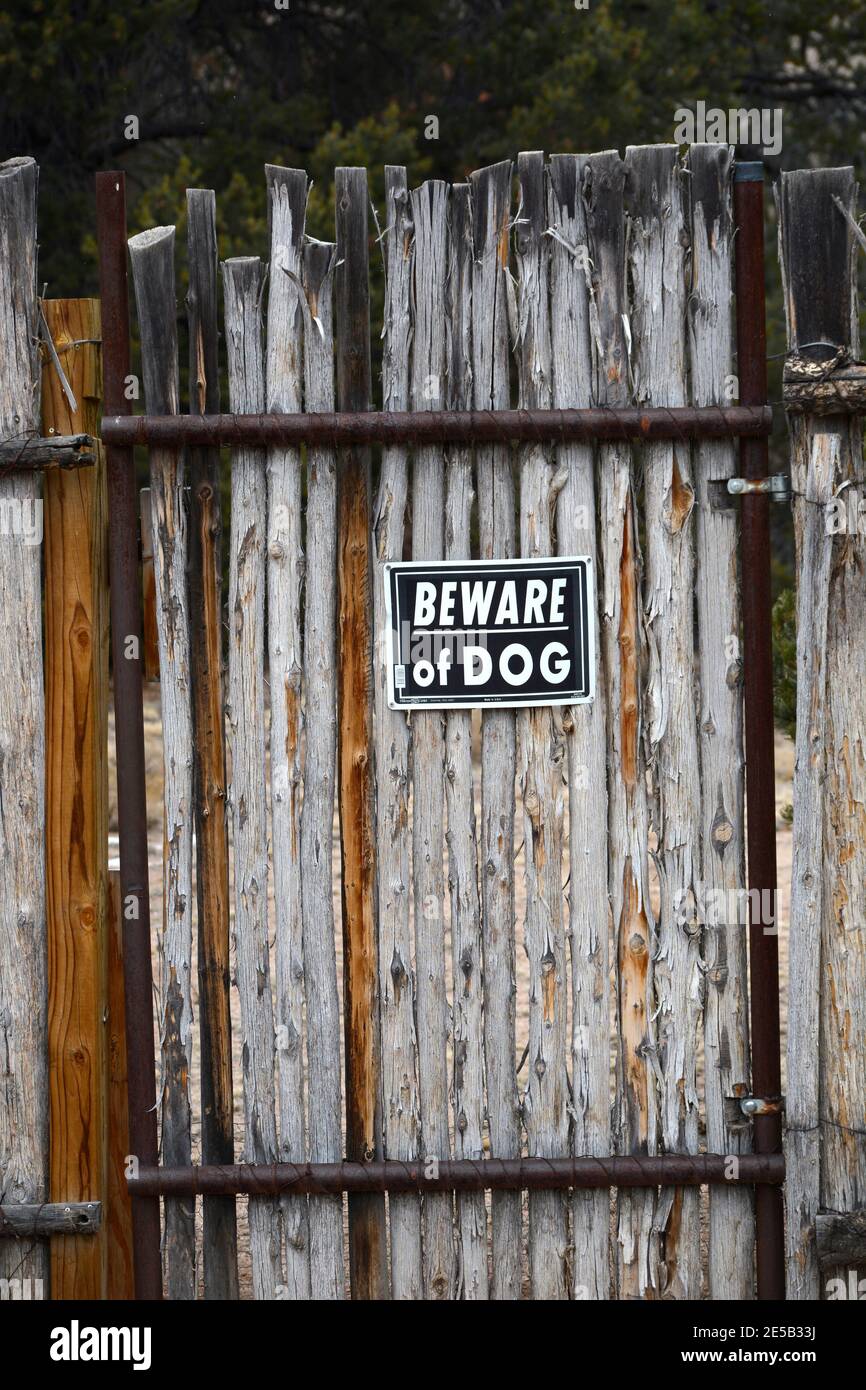 Beware Of Dog Sign On Fence