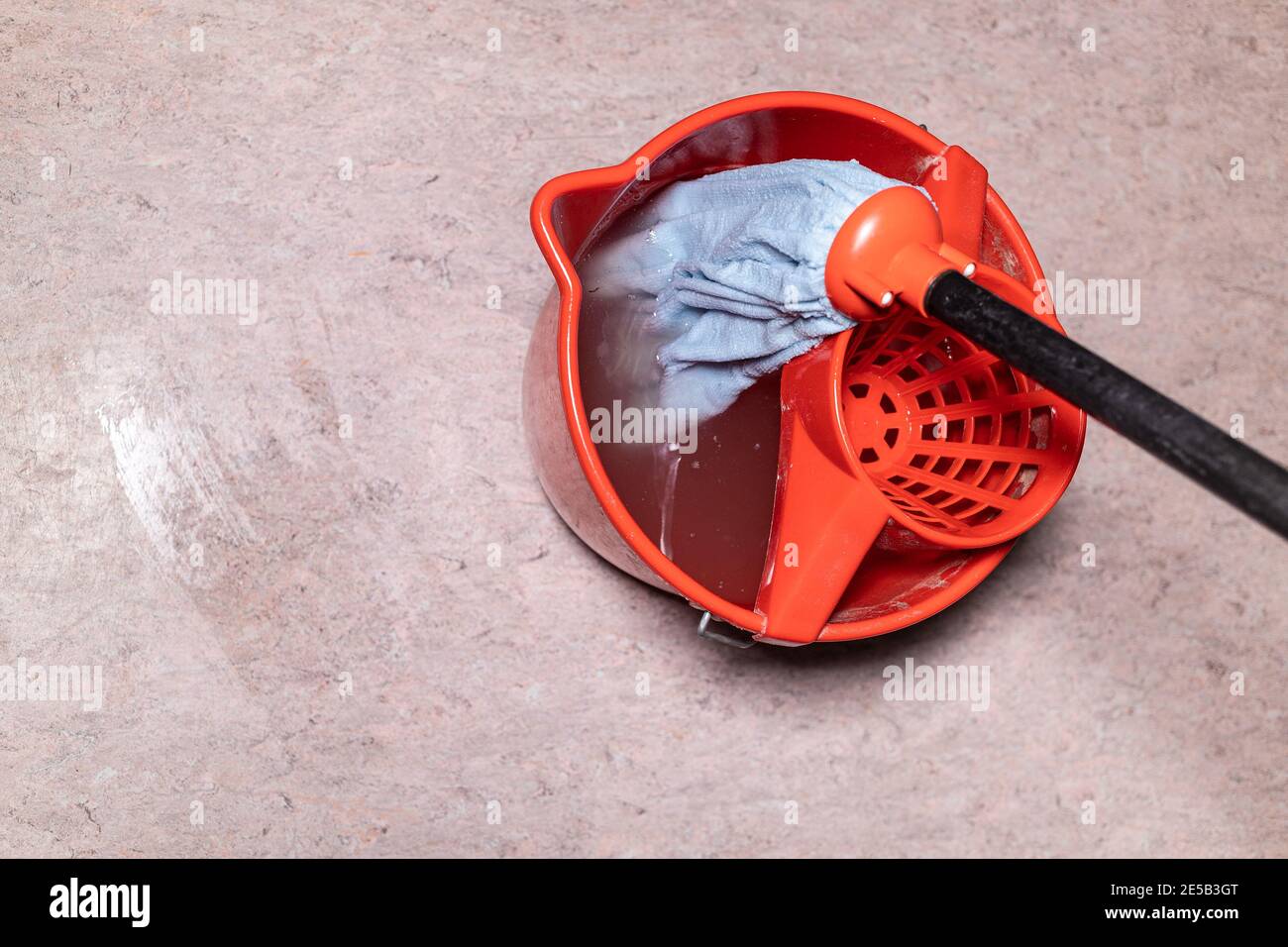 top view of mop in red bucket with dirty water at home Stock Photo - Alamy