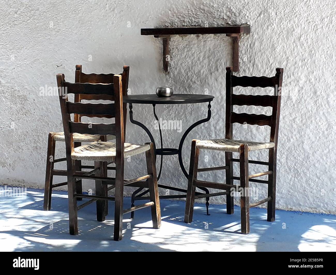 Traditional Greek café chairs and table, Dhonoussa island, Cyclades ...