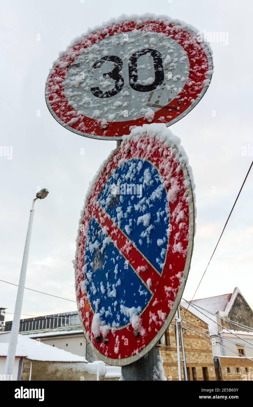 Traffic signs covered with snow, Sopron, Hungary Stock Photo - Alamy