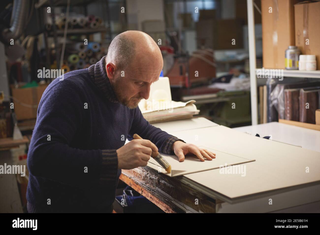 book binder stick a cover Stock Photo - Alamy