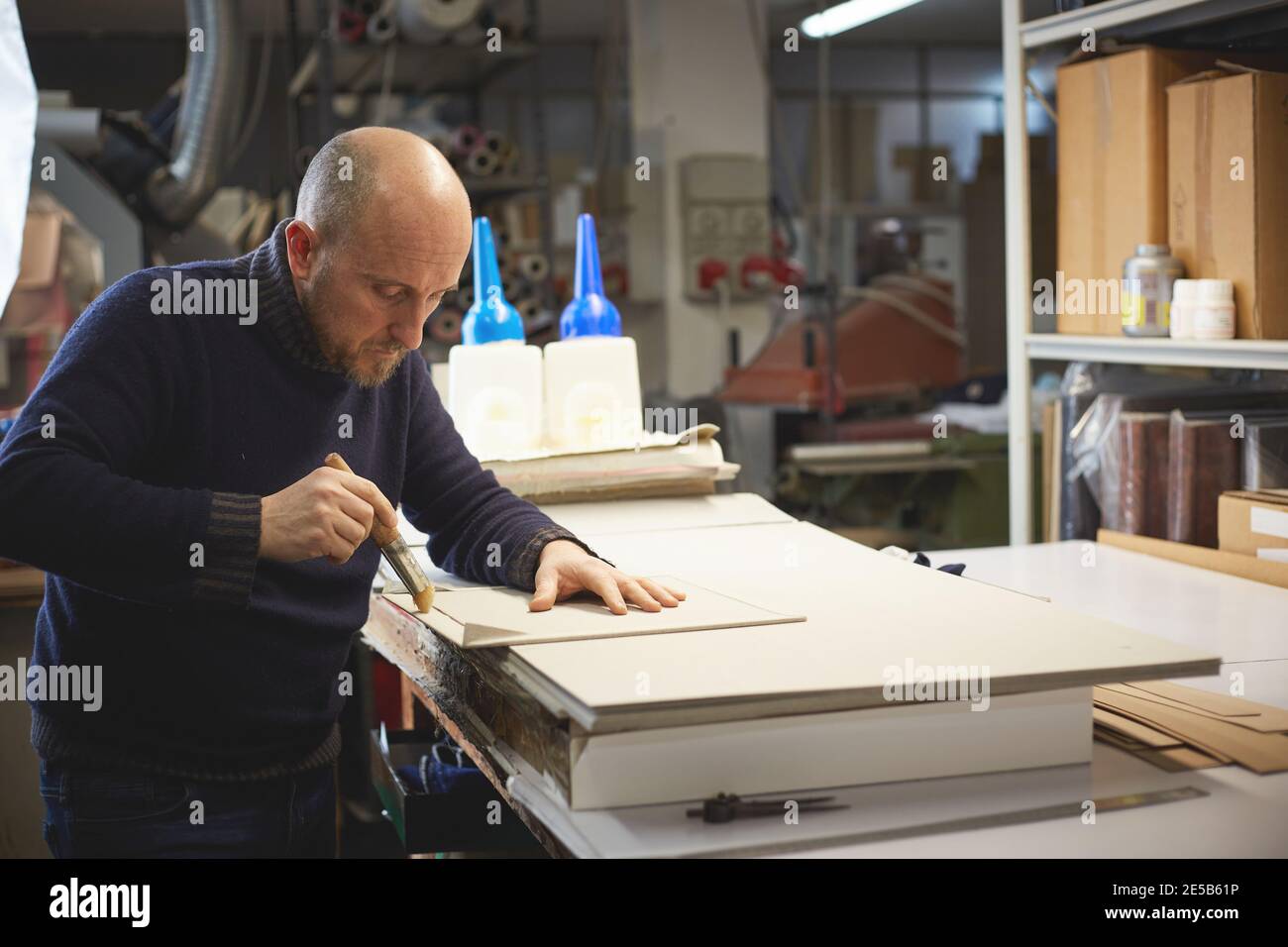 book binder stick a cover Stock Photo - Alamy