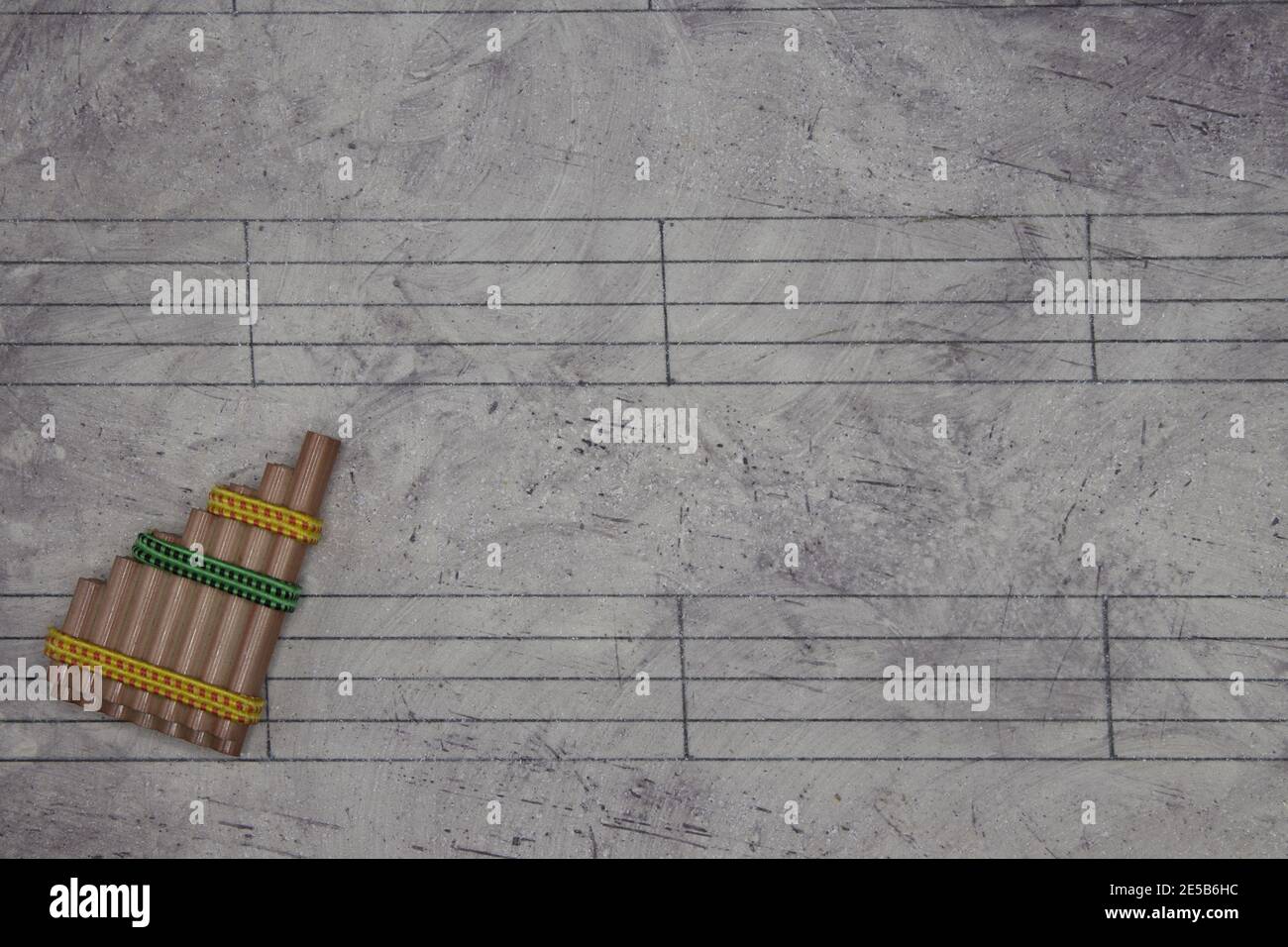 Music sheet background with a miniature instrument Stock Photo - Alamy