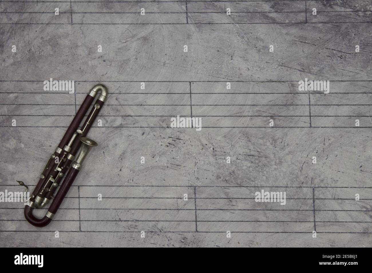 Music sheet background with a miniature wind instrument Stock Photo - Alamy