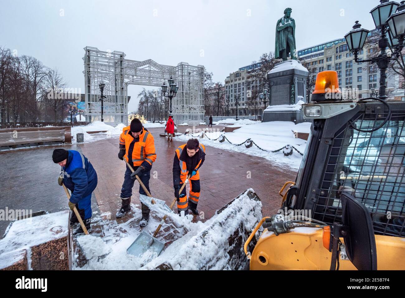 Russia, Moscow. Utility workers clean snow on Pushkinskaya Square Stock ...