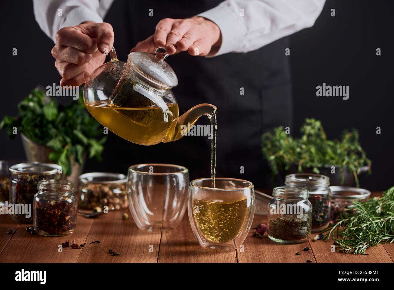 Two cups and pouring tea hi-res stock photography and images - Alamy