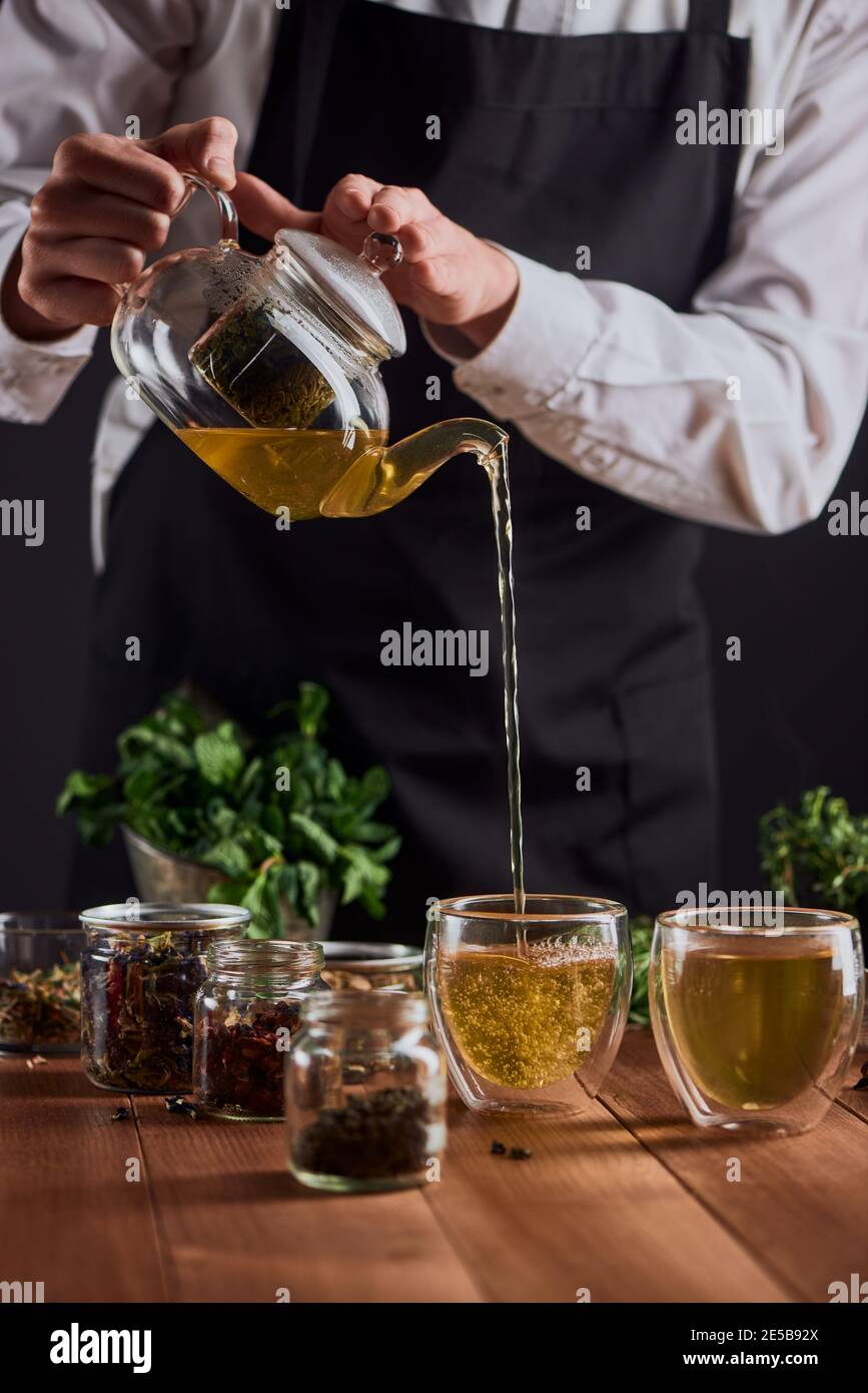 Two cups and pouring tea hi-res stock photography and images - Alamy