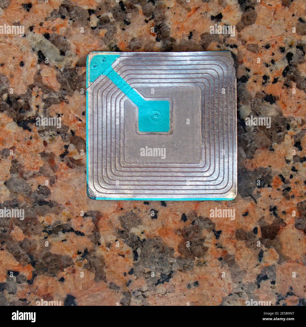 Soft label security magnetic tag anti theft at marble Stock Photo - Alamy