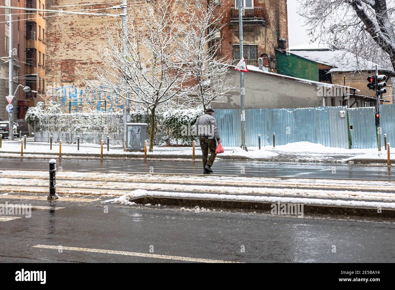 Snow covered road with pedestrian crossing hi-res stock photography and ...