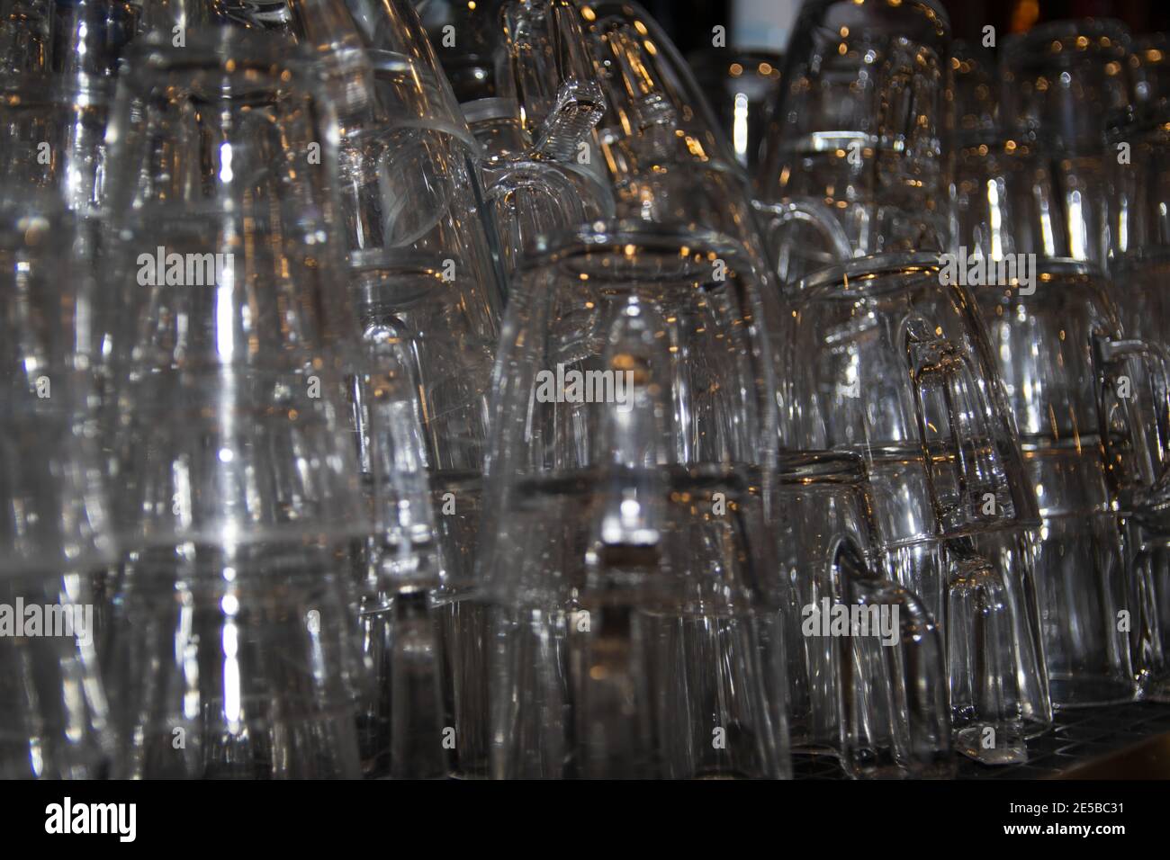 Closeup shot of many glasses stacked at the bar Stock Photo - Alamy