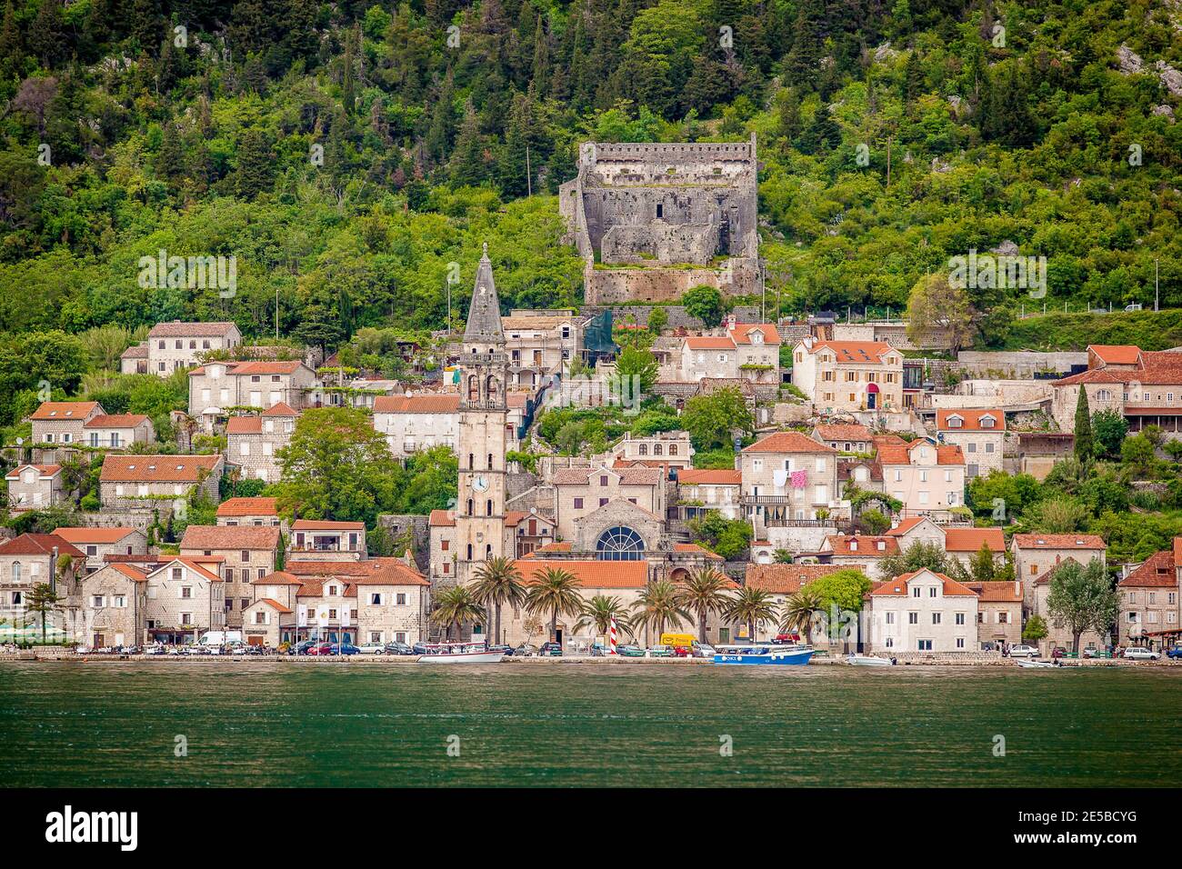Beautiful shot of a castle and house buildings on the beach of ...