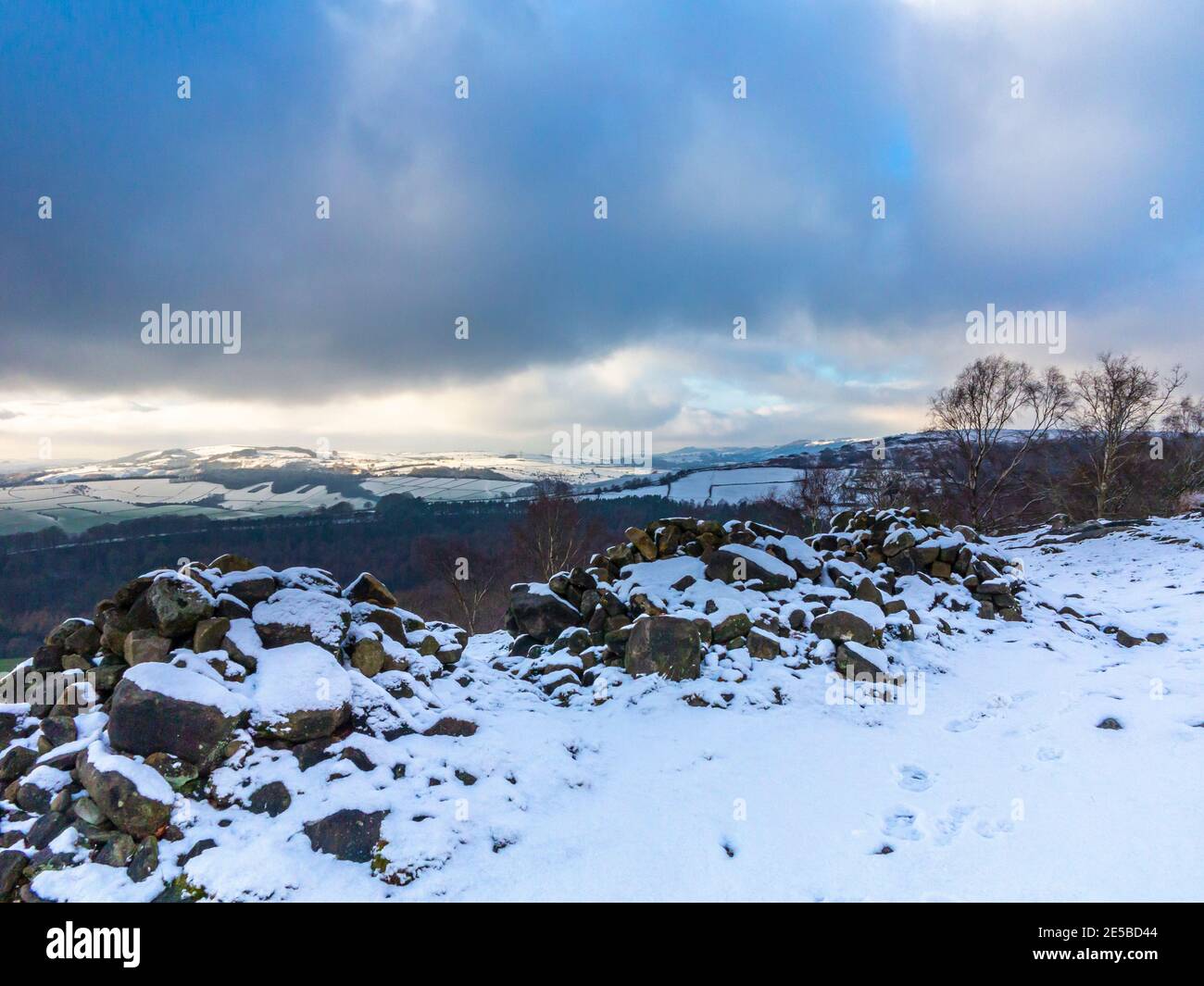 Winter view with trees and snow covered rocks at Gardom's Edge near ...