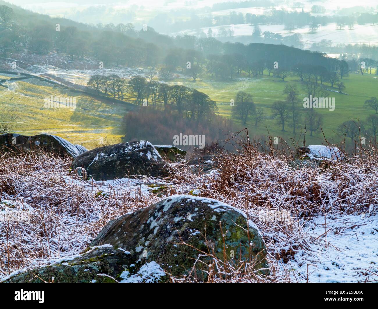Winter view with trees and snow covered rocks at Gardom's Edge near ...