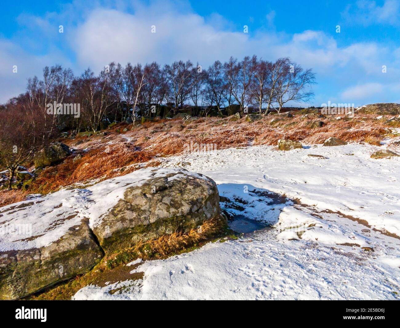 Winter view with trees and snow covered rocks at Gardom's Edge near ...