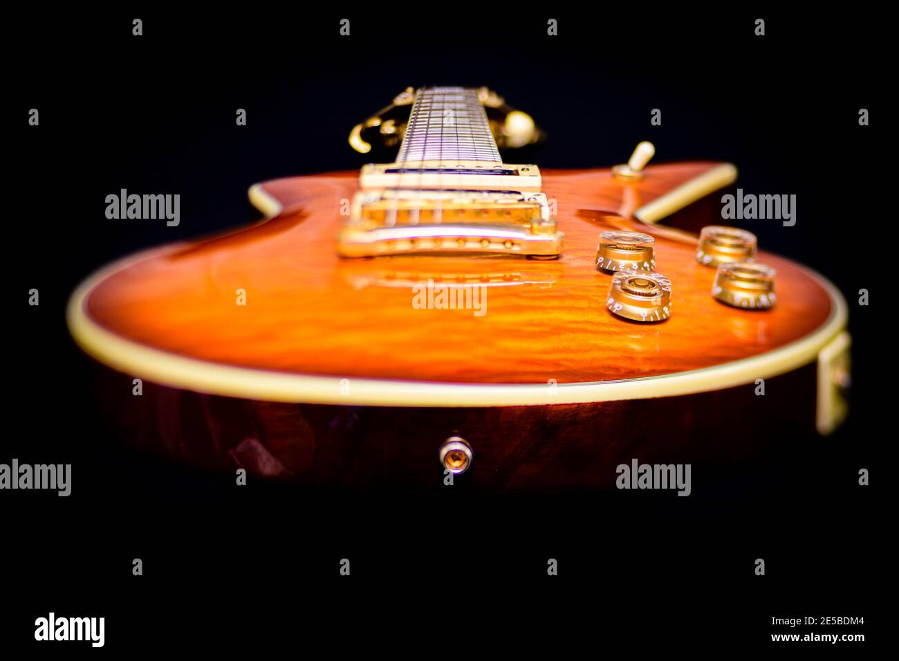 Low angle of isolated vintage electric guitar with sunburst finish on a ...