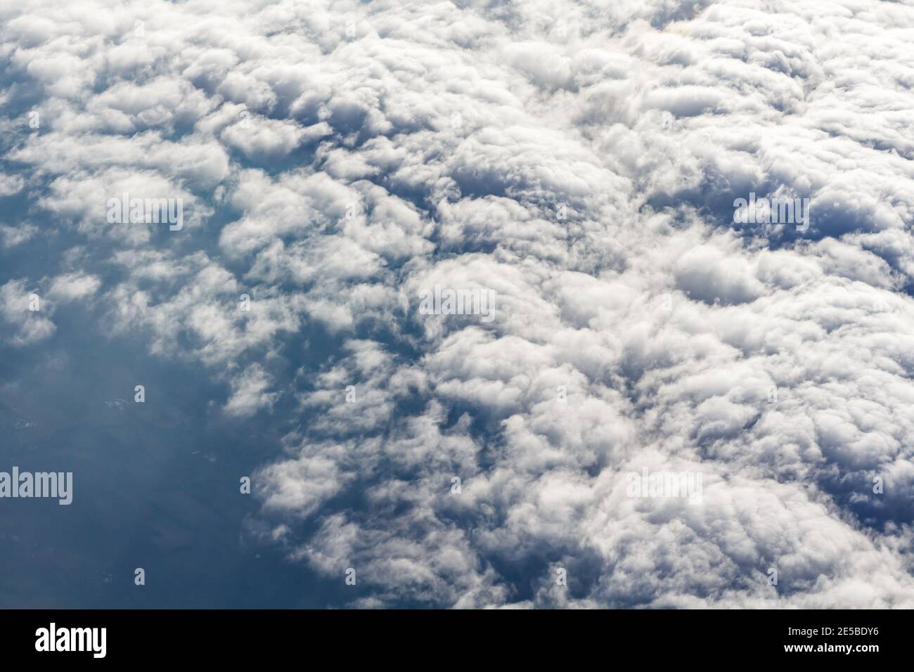 An aerial view above cloud cover shows the texture of the clouds Stock ...