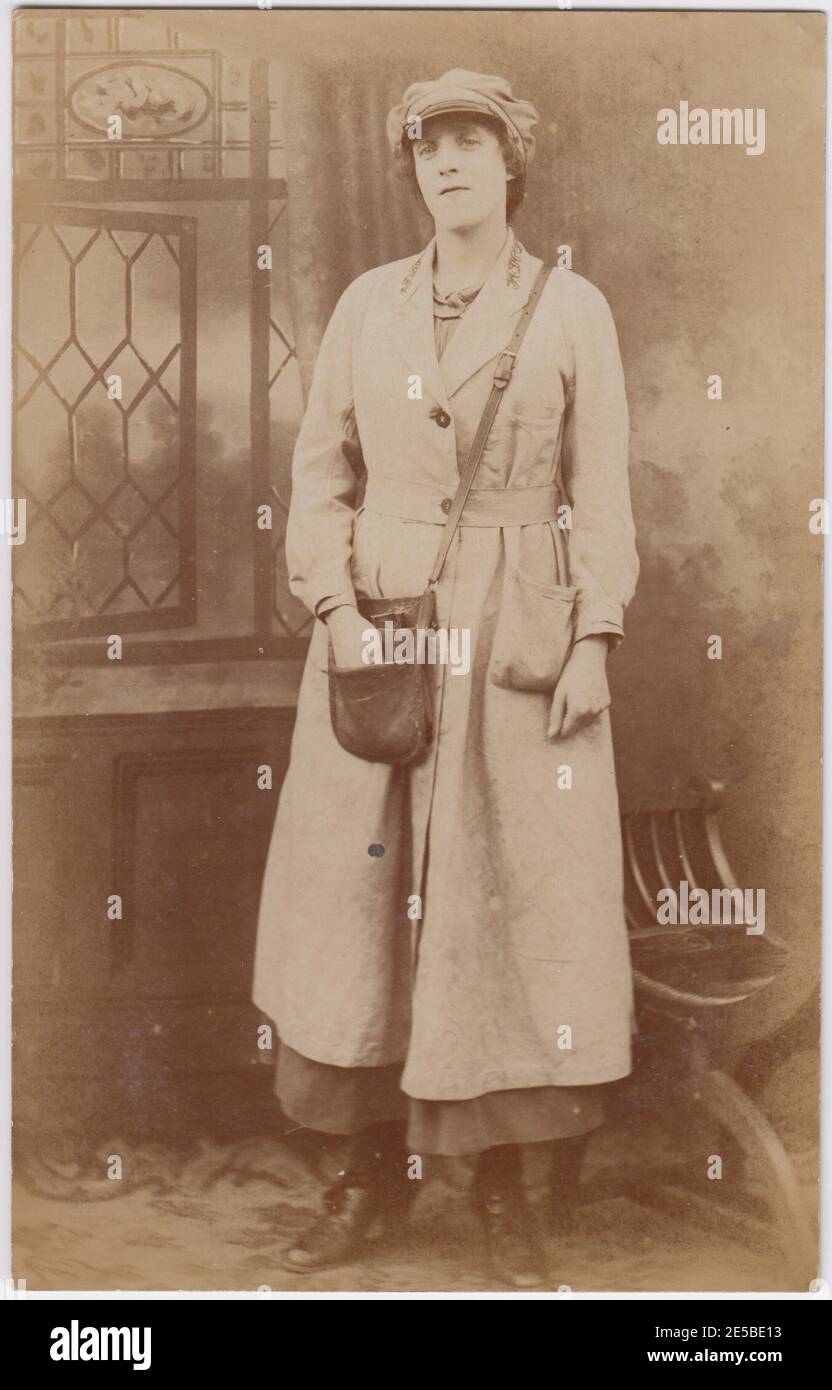 Woman standing in the uniform of a bus conductor / conductress, First ...