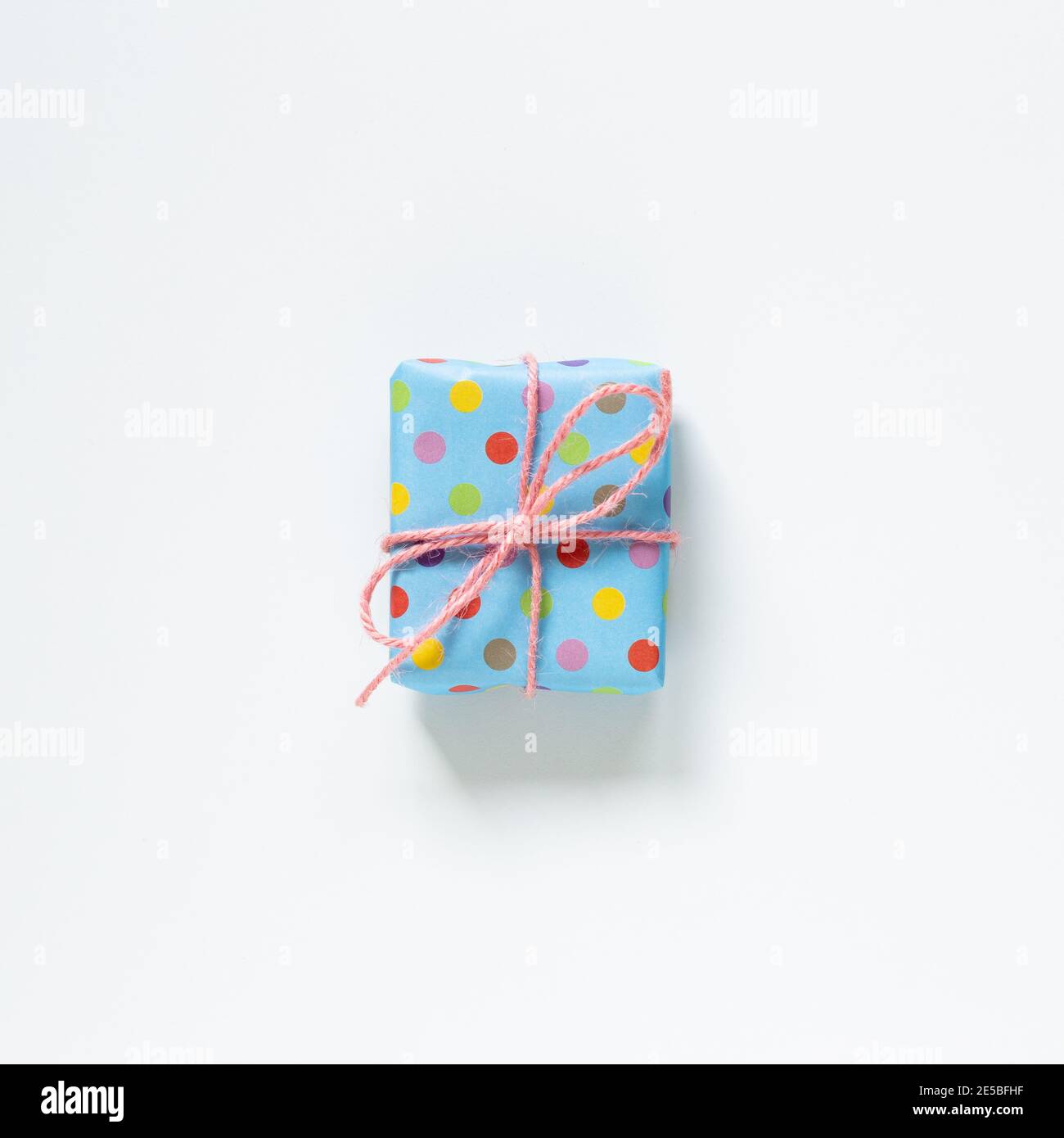 Dot pattern sky blue gift box isolated on white background. top view ...