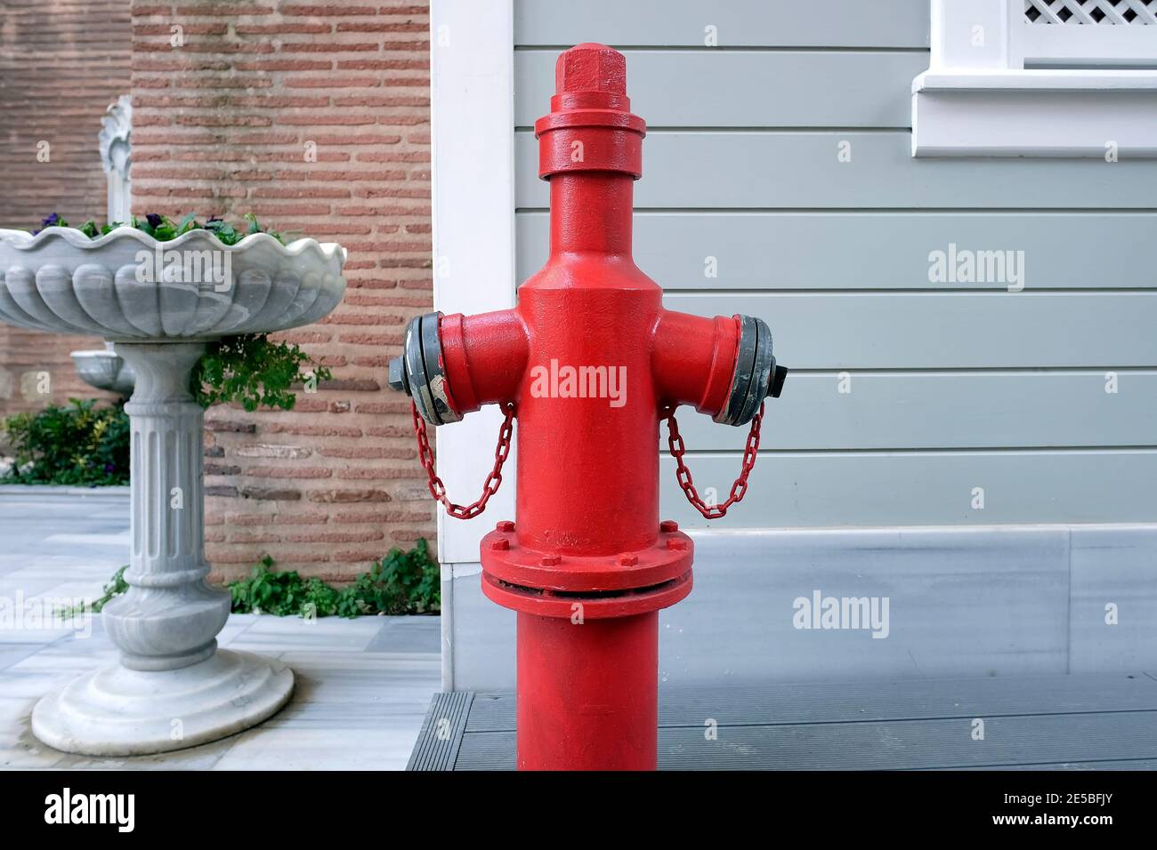 A nice looking bright red fire hydrant Stock Photo - Alamy