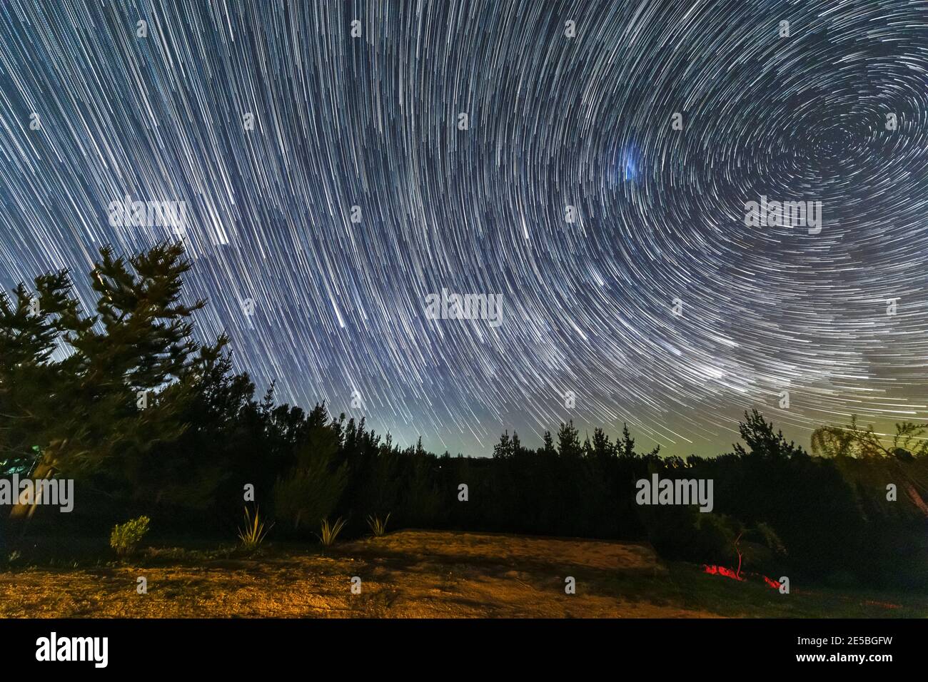 The Earth rotation as seen in the night sky with the star trails. An ...