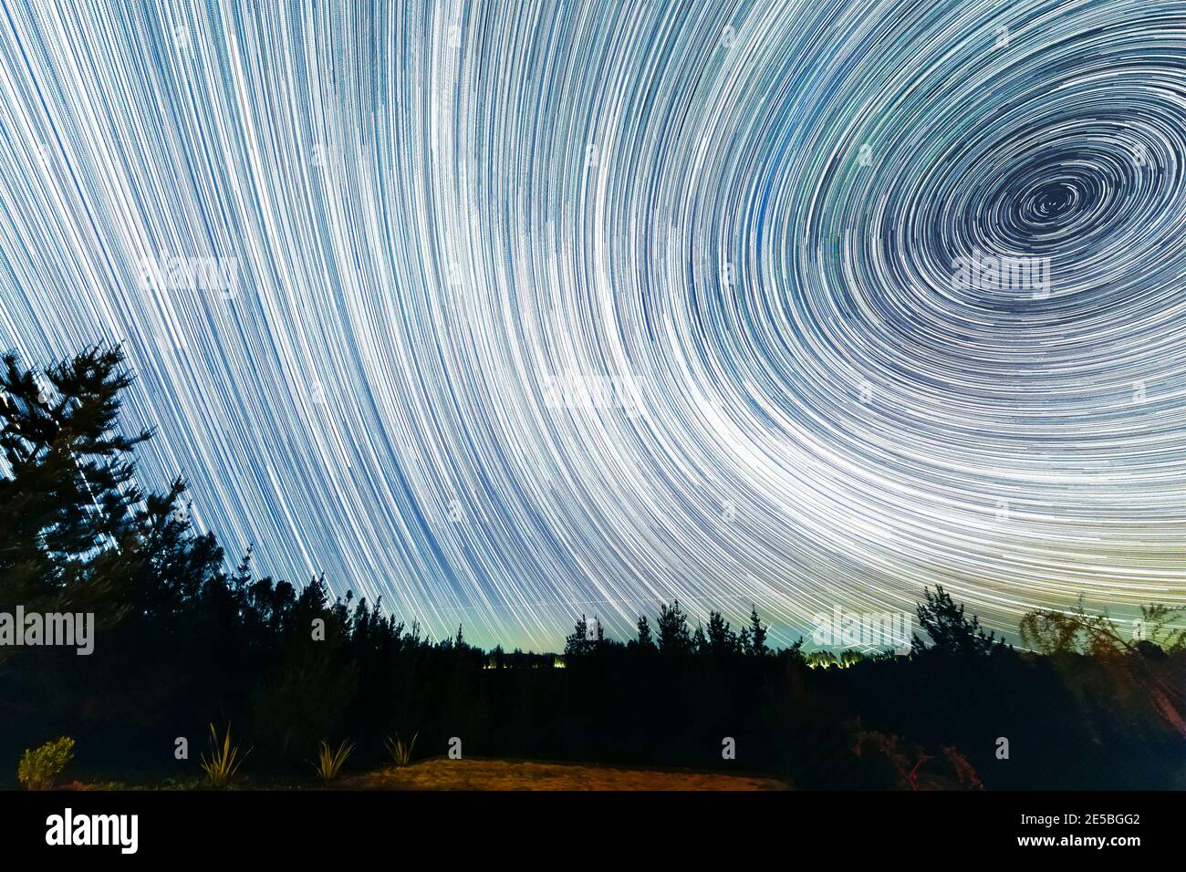 The Earth rotation as seen in the night sky with the star trails. An ...