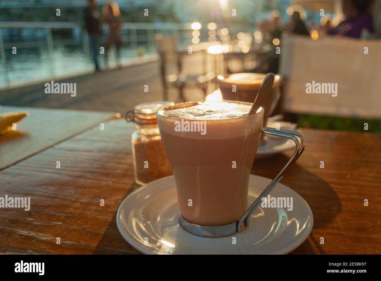 Selective focus shot of cortado coffee with milk in a glass cup on the ...