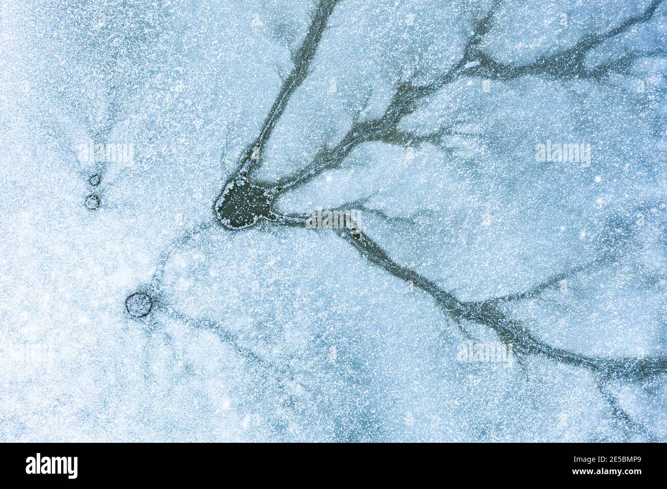 Aerial view of frozen lake. Aerial photography during winter season ...