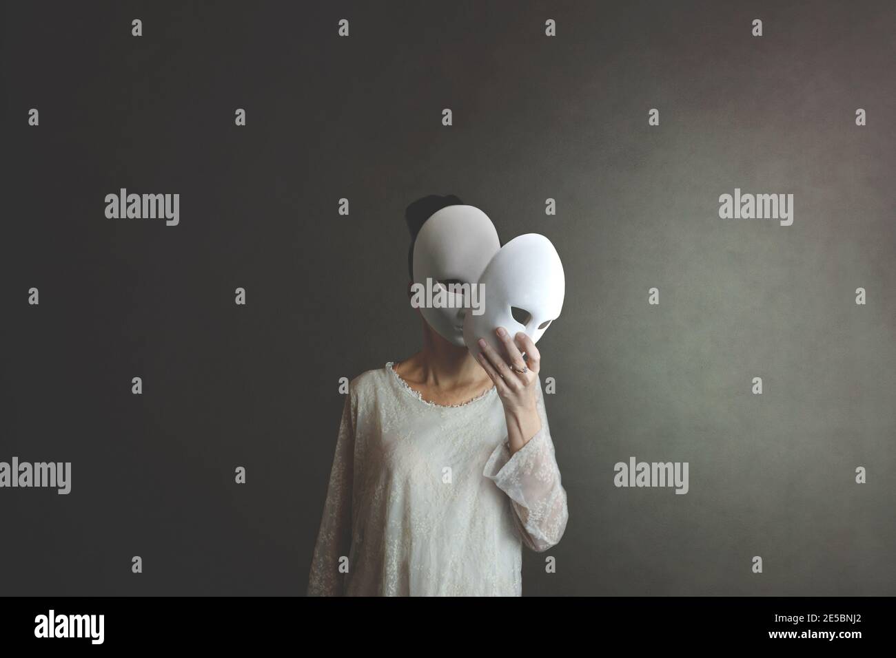 woman takes off the mask from her face but underneath her she has ...