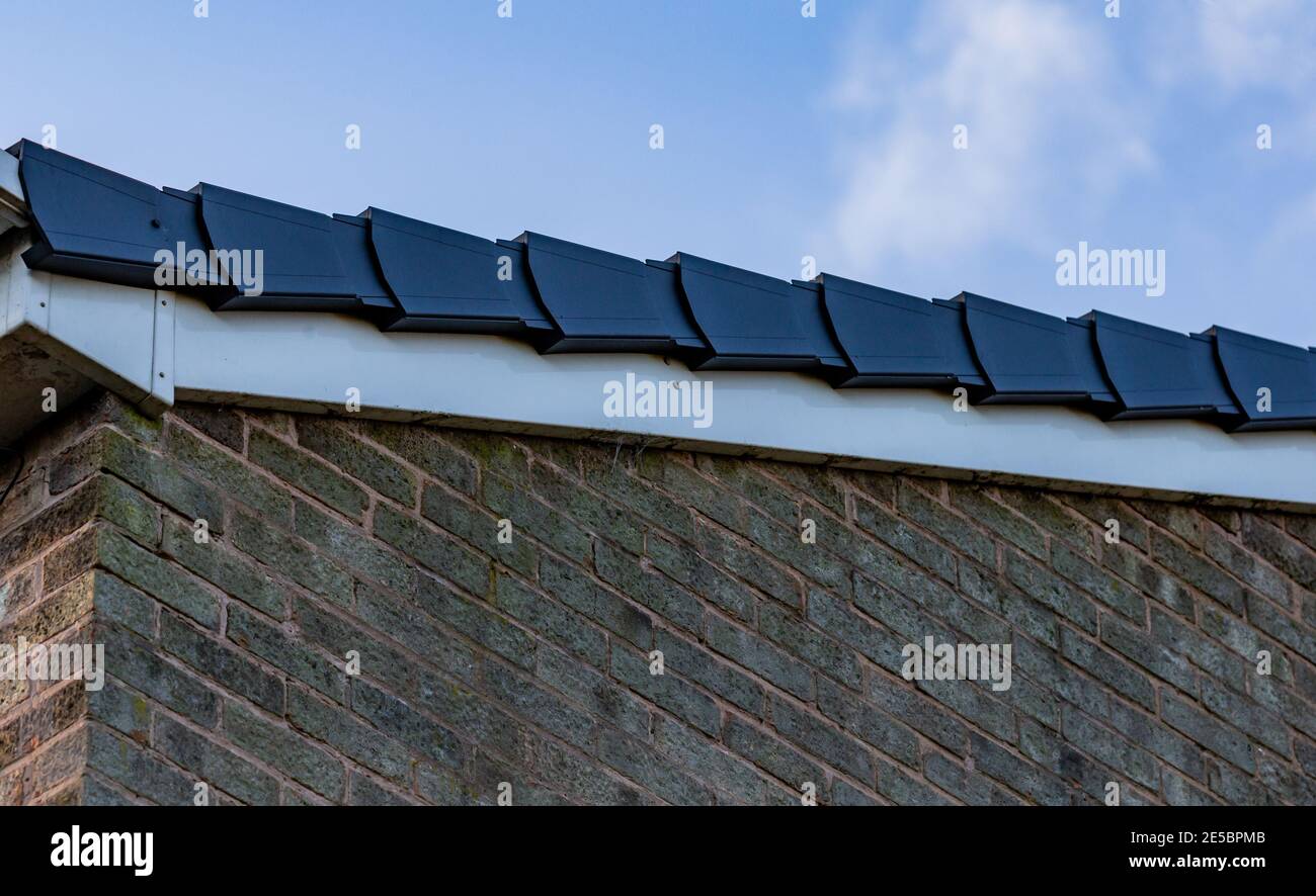 A dry verge system on the roof of a house Stock Photo - Alamy