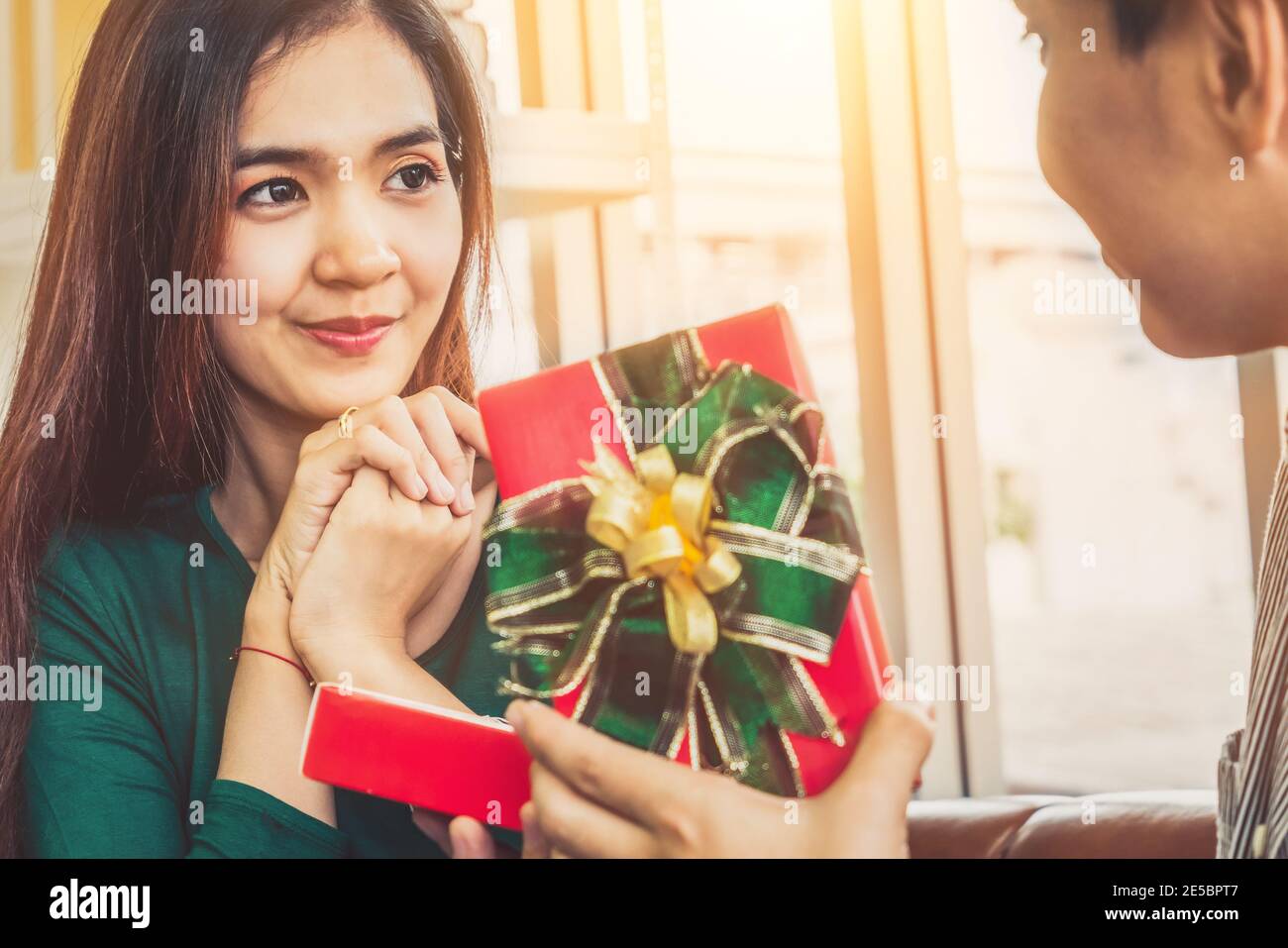 Happy couple giving gift present to celebrate anniversary. Marriage ...