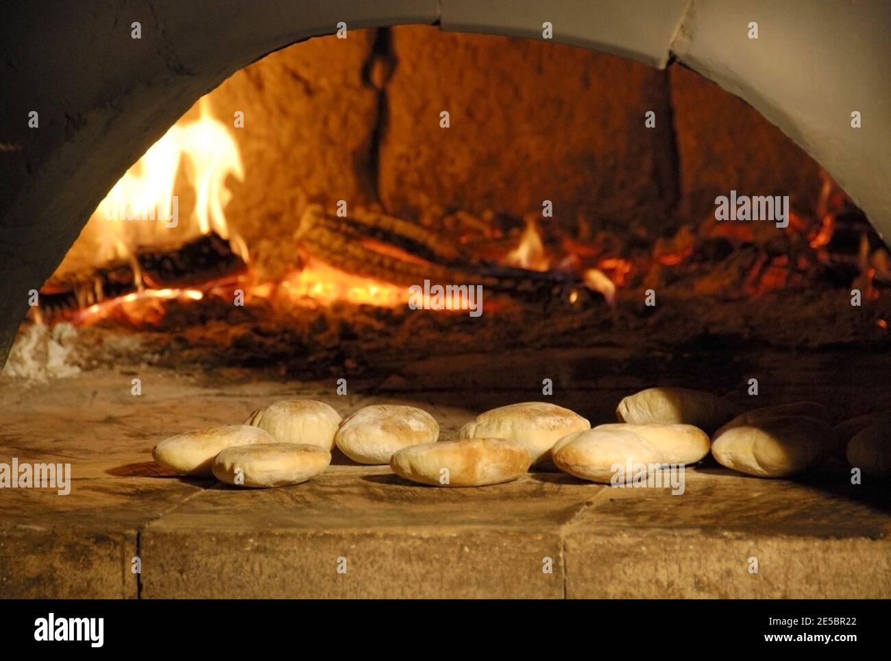 Traditional bread made in old wood fired oven Stock Photo - Alamy