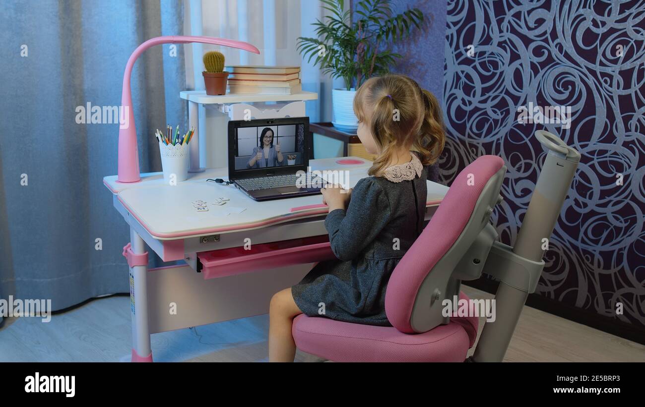 Preschool child girl distance online learning at home. Cute kid pupil ...